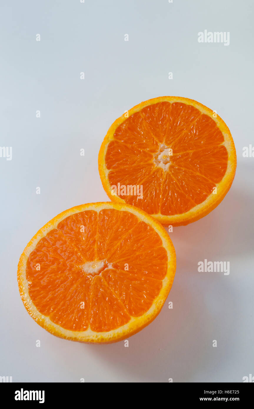 Orange sliced in two halves Stock Photo - Alamy