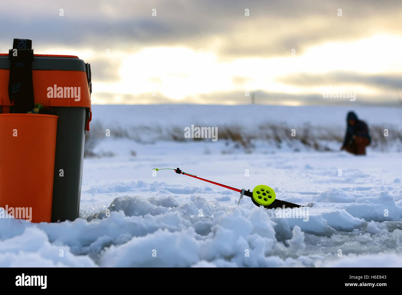 Little winter fishing rod ice Stock Photo - Alamy
