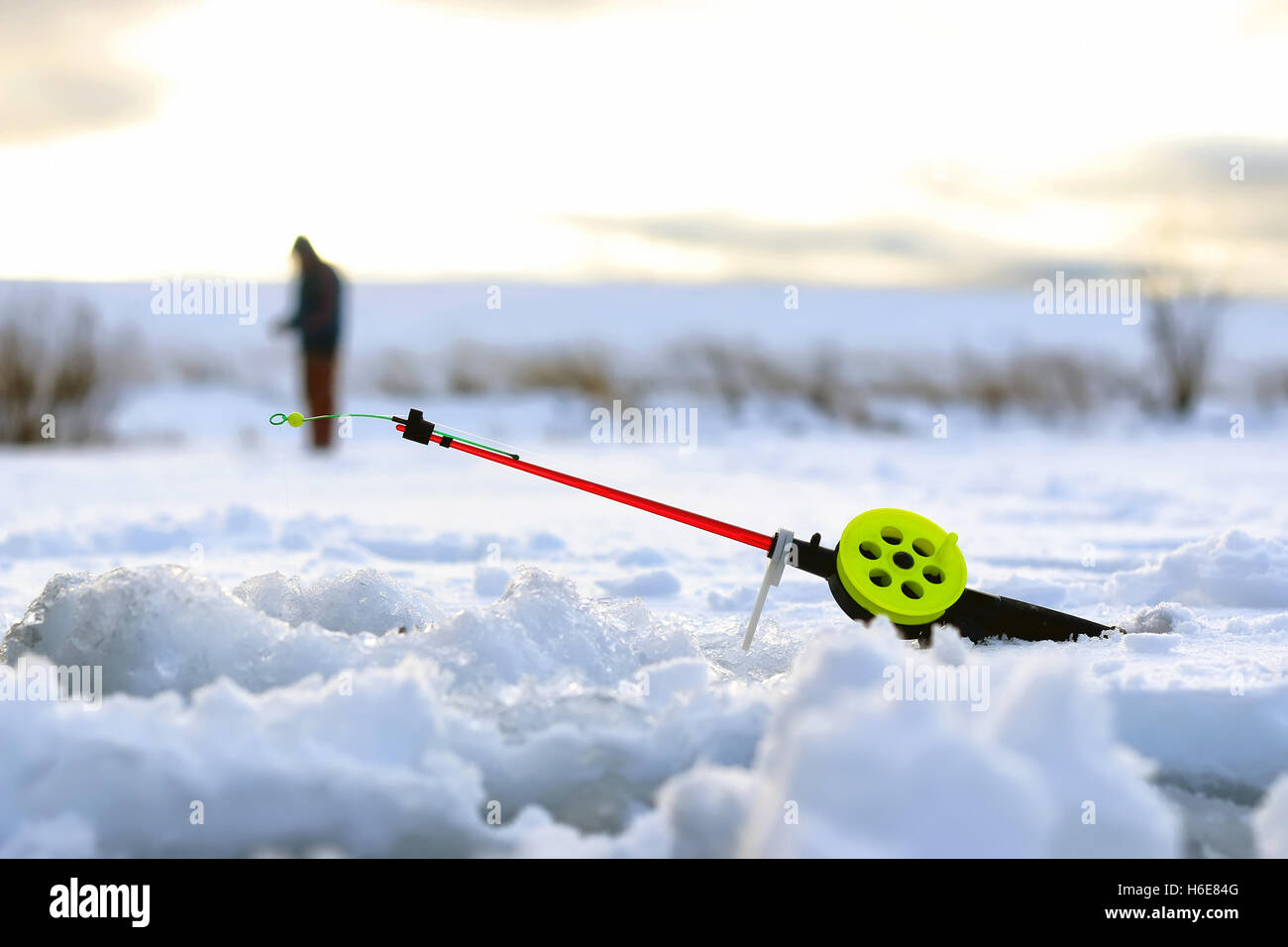 Little winter fishing rod ice Stock Photo - Alamy