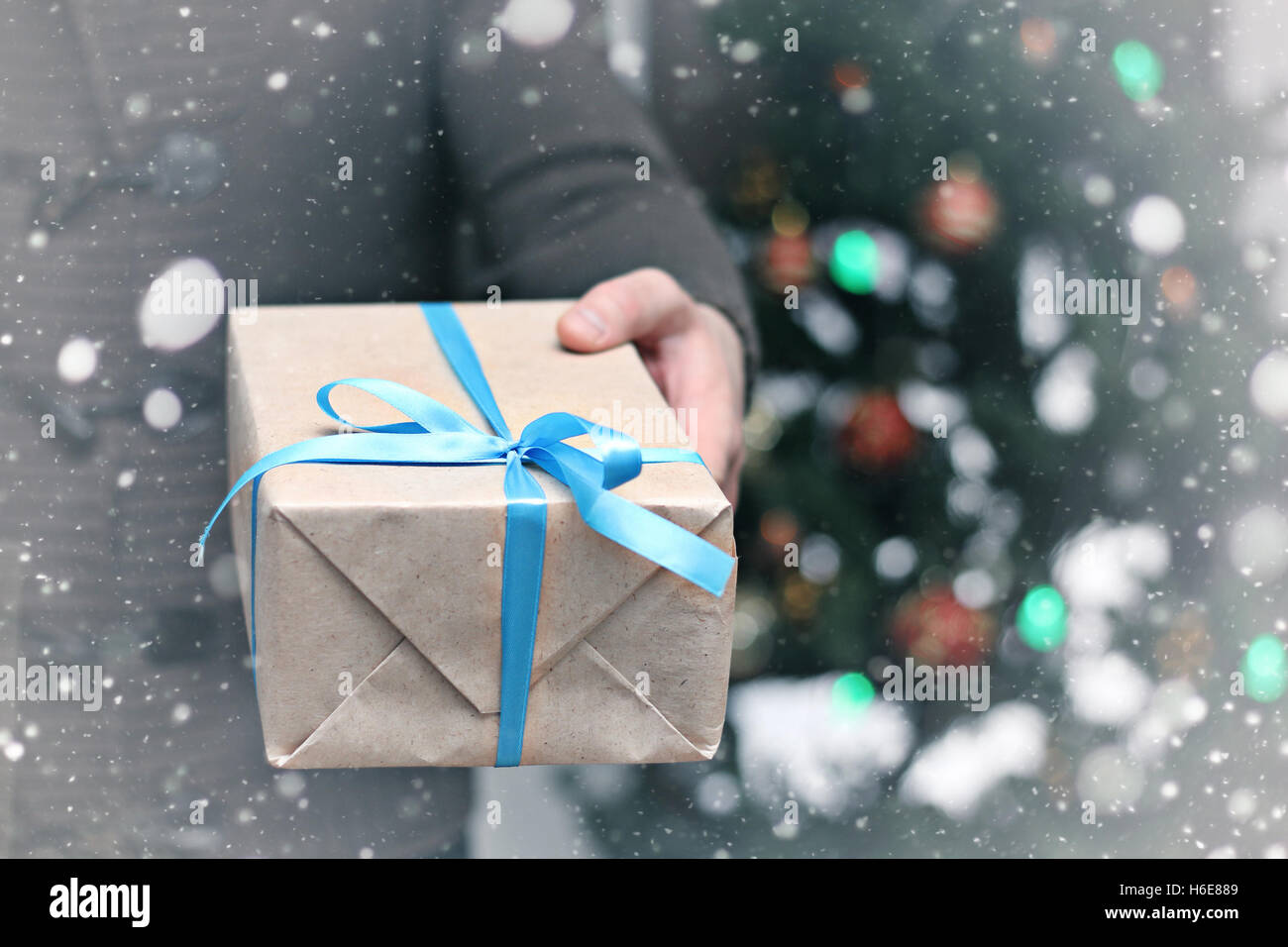 gift giving hand christmas Stock Photo - Alamy