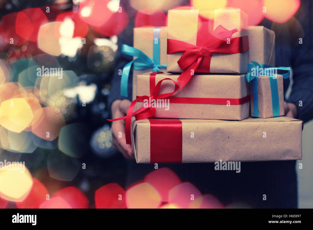 gift stack hand christmas Stock Photo - Alamy