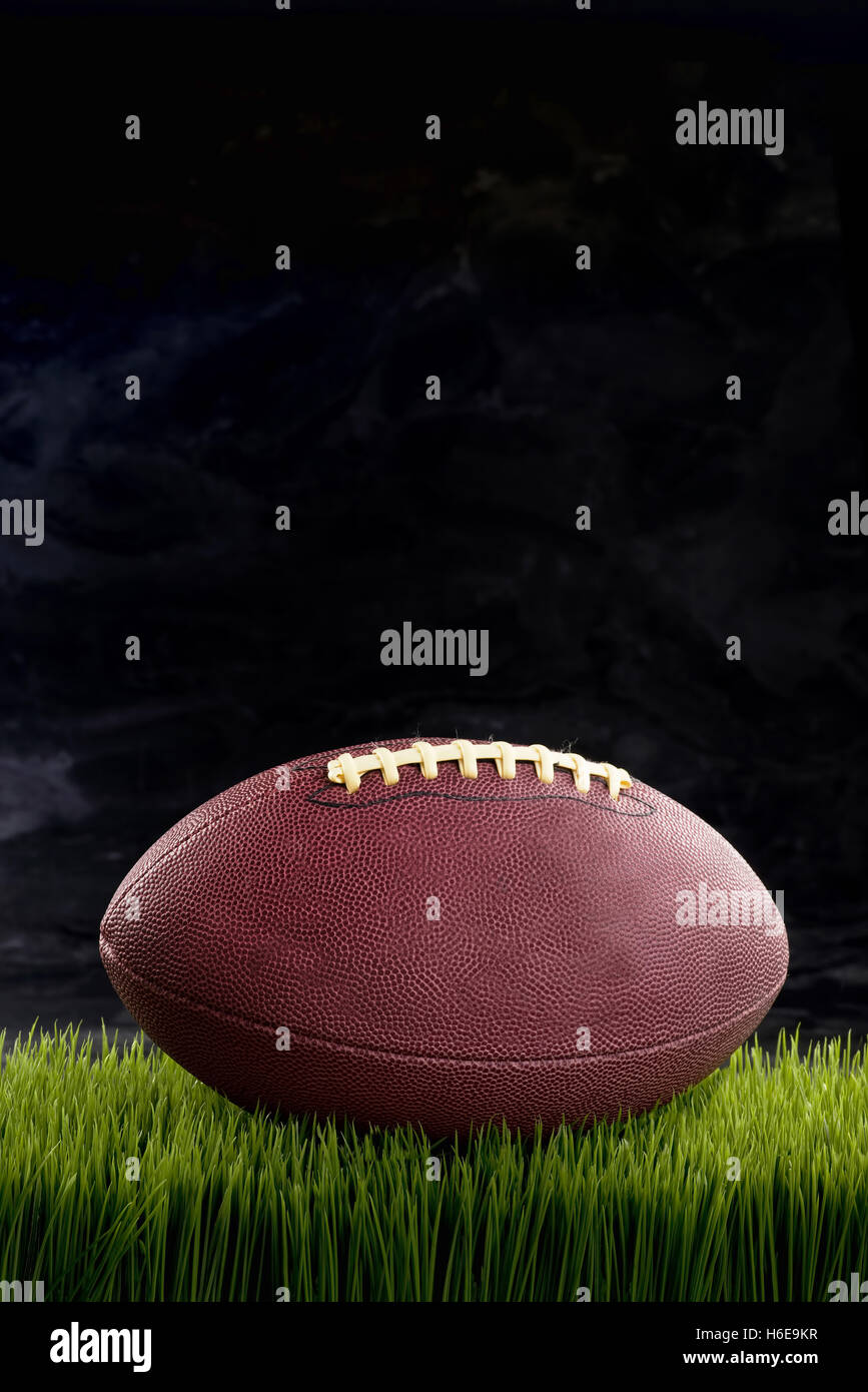 Football Field With Football At Night