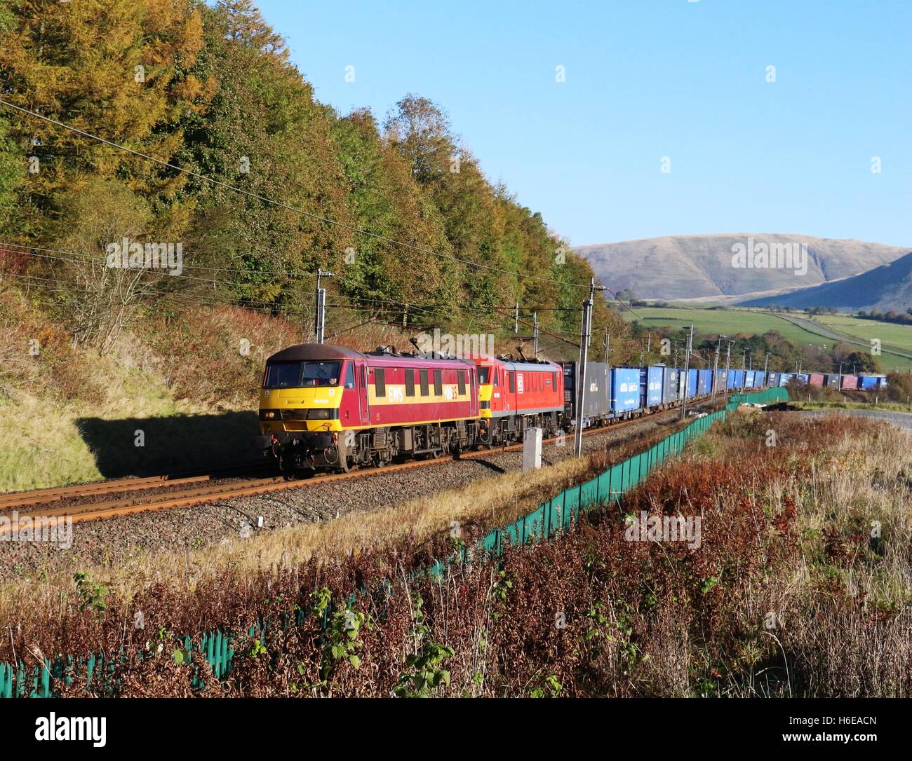 Two class 90 electric locomotives on the West Coast Main Line near ...