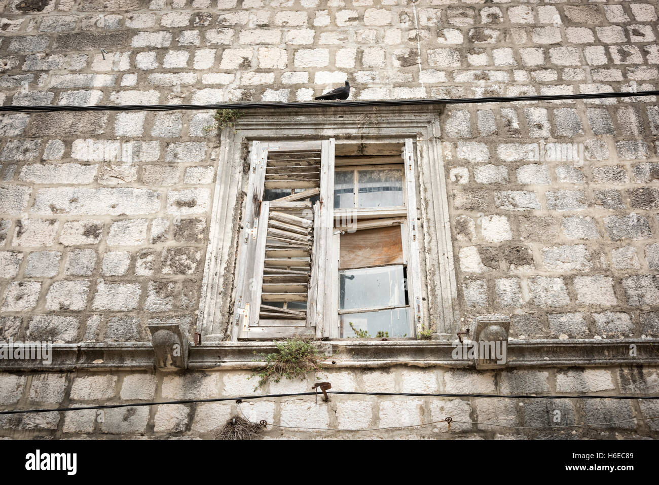 An old rotting window in a house in Ston Croatia showing an ...