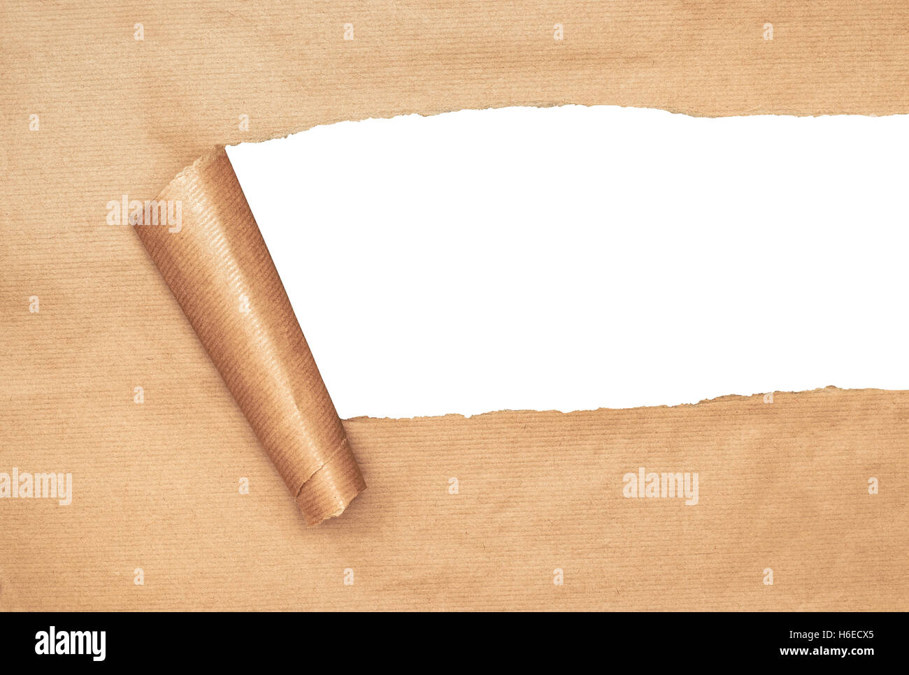 Torn parcel paper revealing white copy space Stock Photo - Alamy
