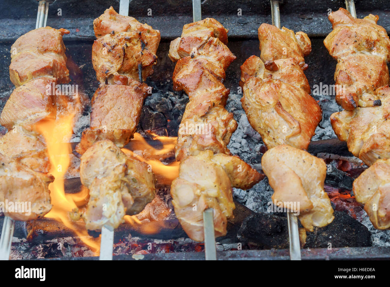 close-up of the fried meat with fire and coal Stock Photo - Alamy