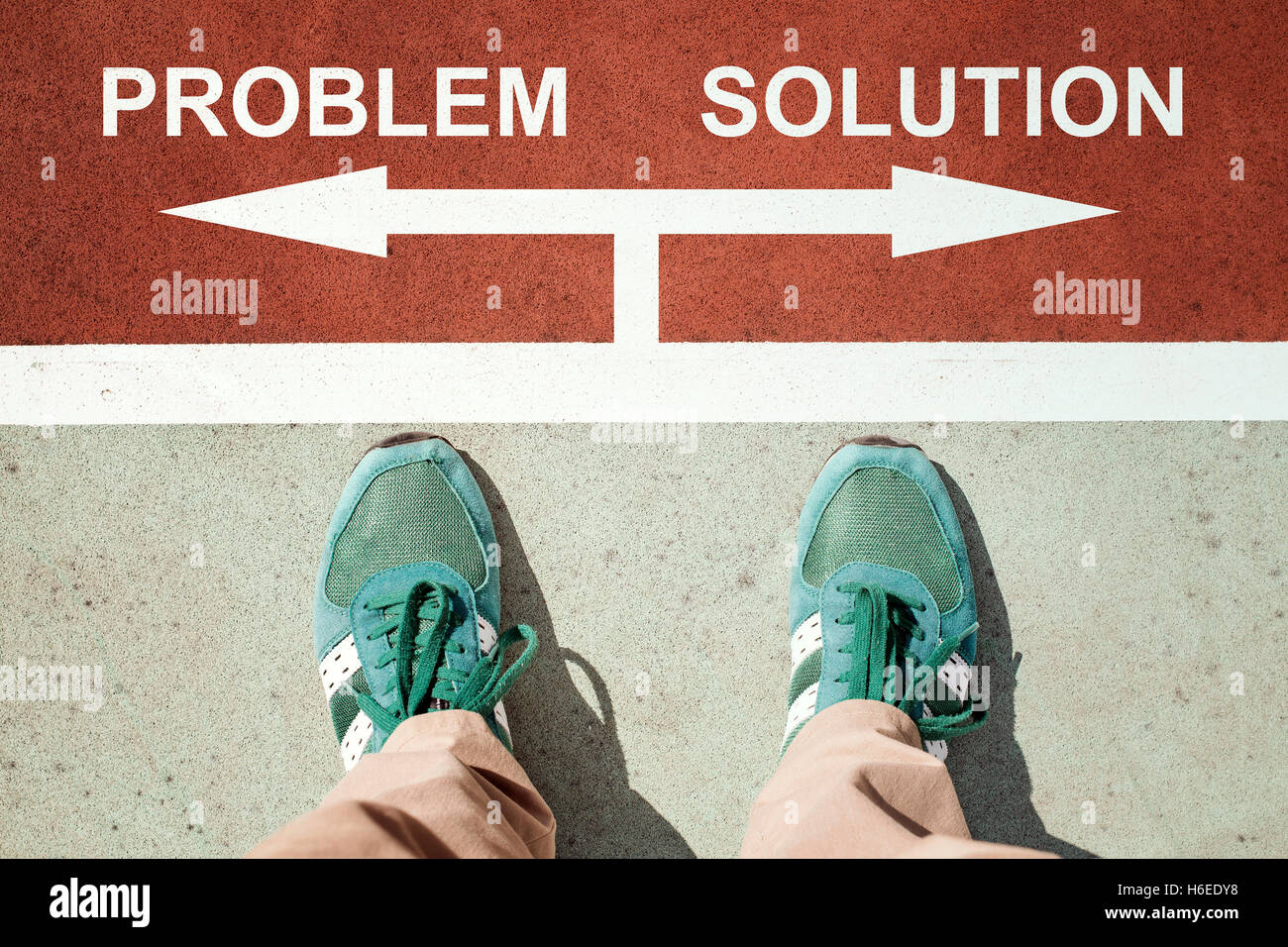 Problem or solution concept with legs from above standing on signs ...