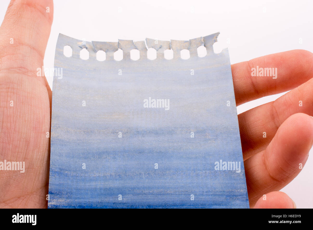 Painted torn note paper on white background Stock Photo - Alamy