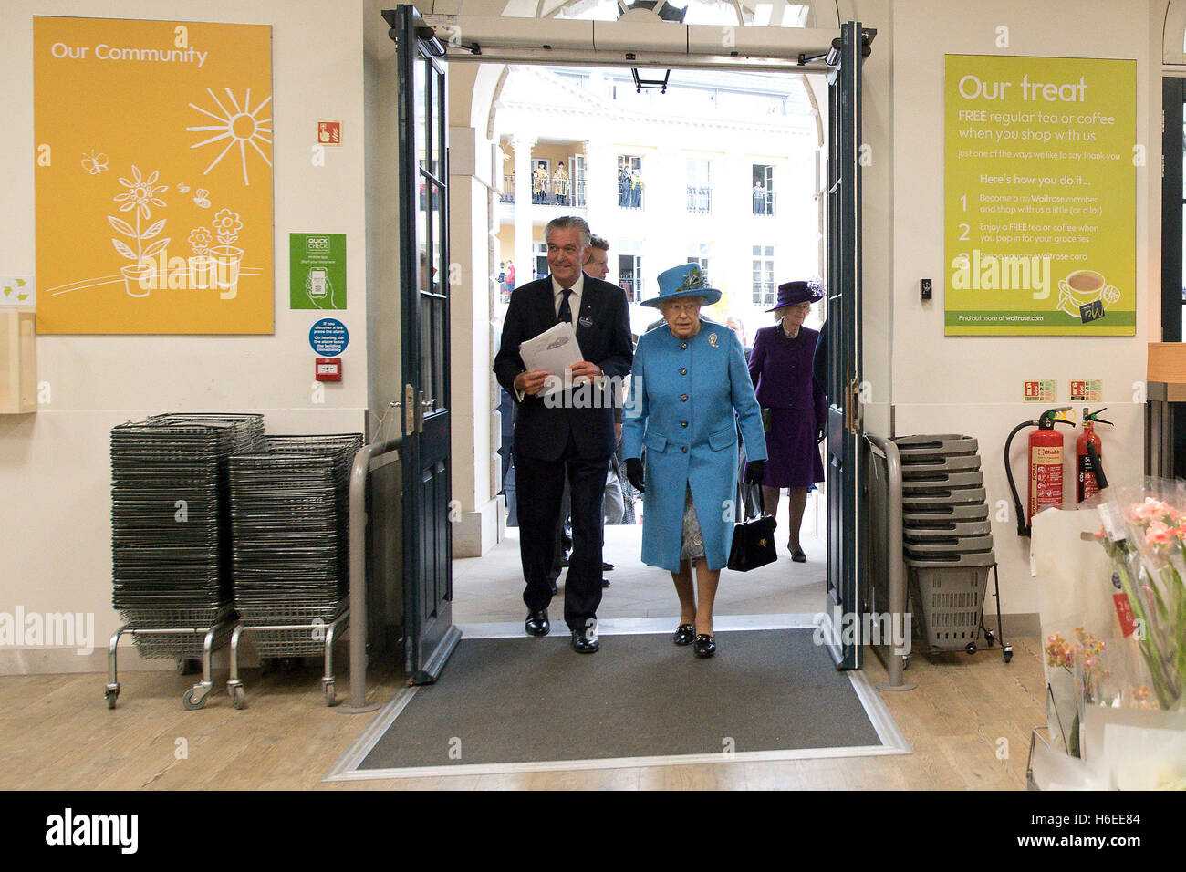 Queen Elizabeth II looks around a Waitrose supermarket during a visit ...