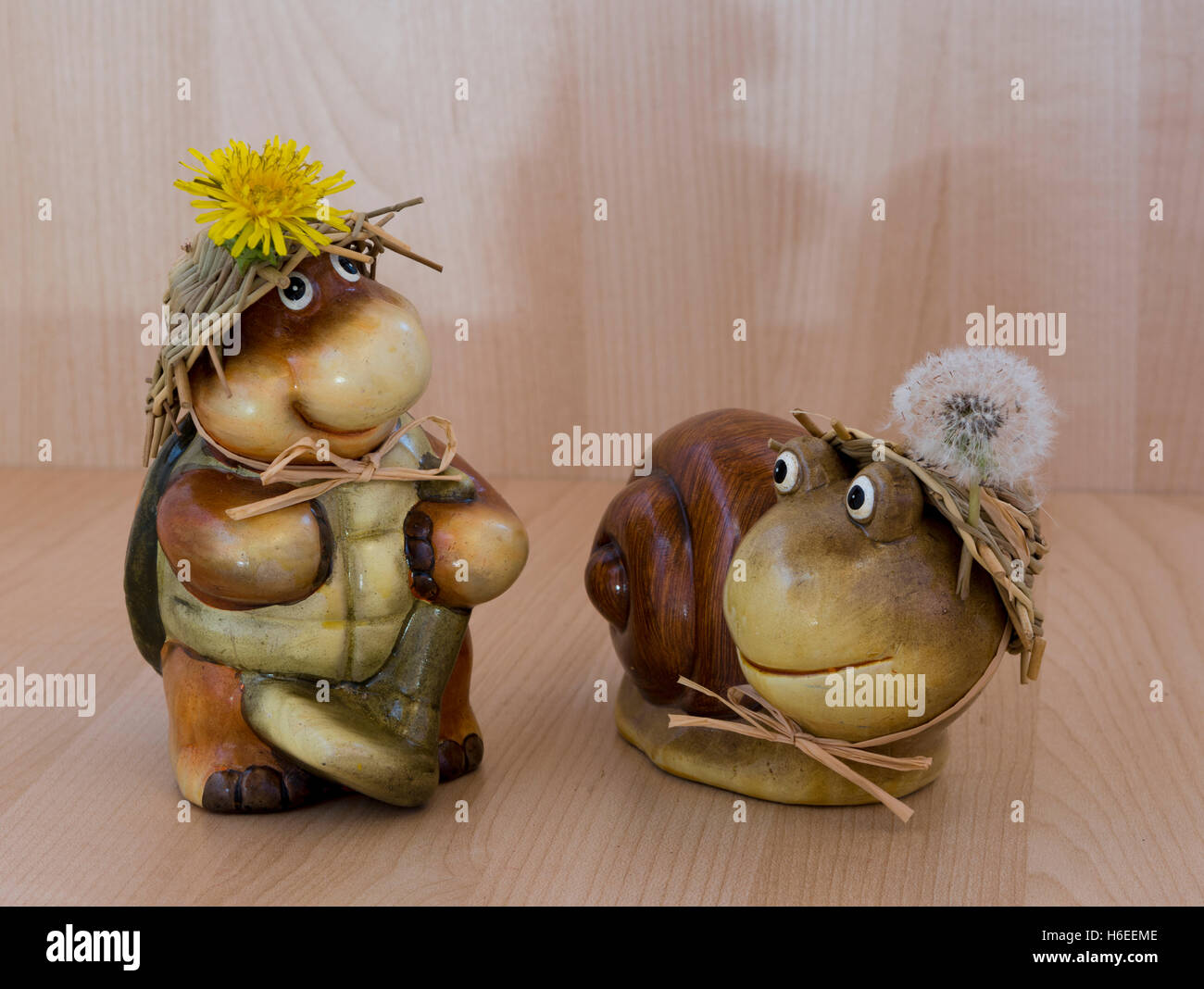 Ceramic toys act out a scene from a children's book about a meeting of ...