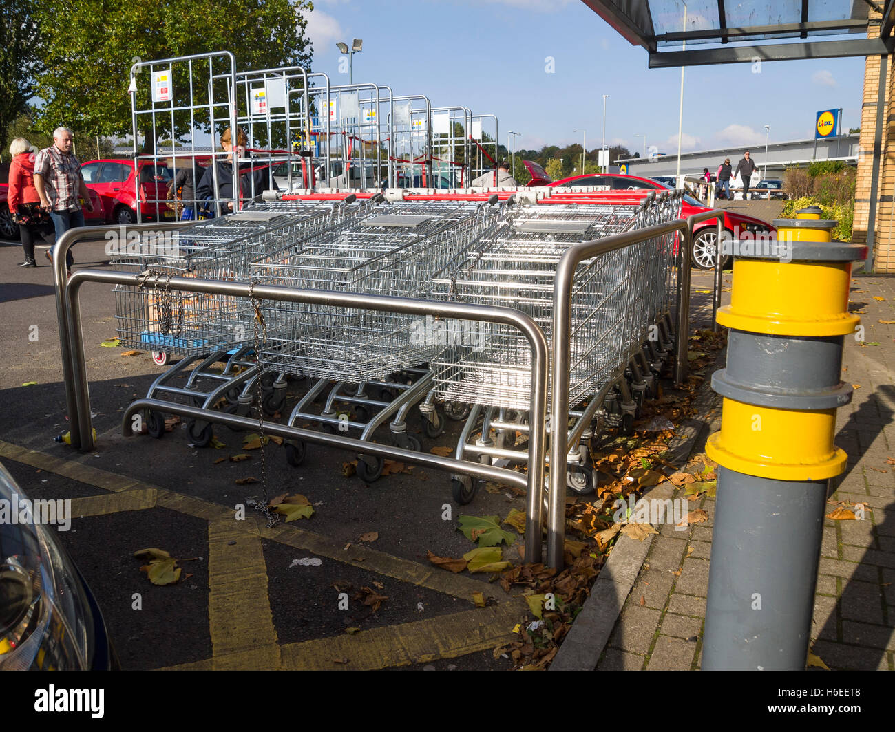 shopping trolleys outside store Stock Photo - Alamy