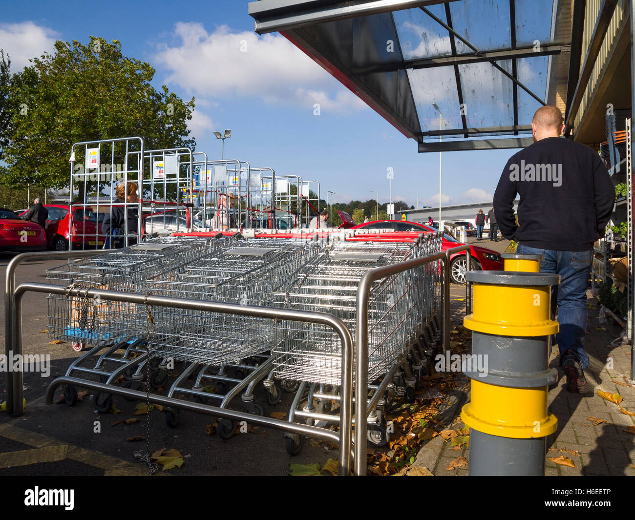 shopping trolleys outside store Stock Photo - Alamy