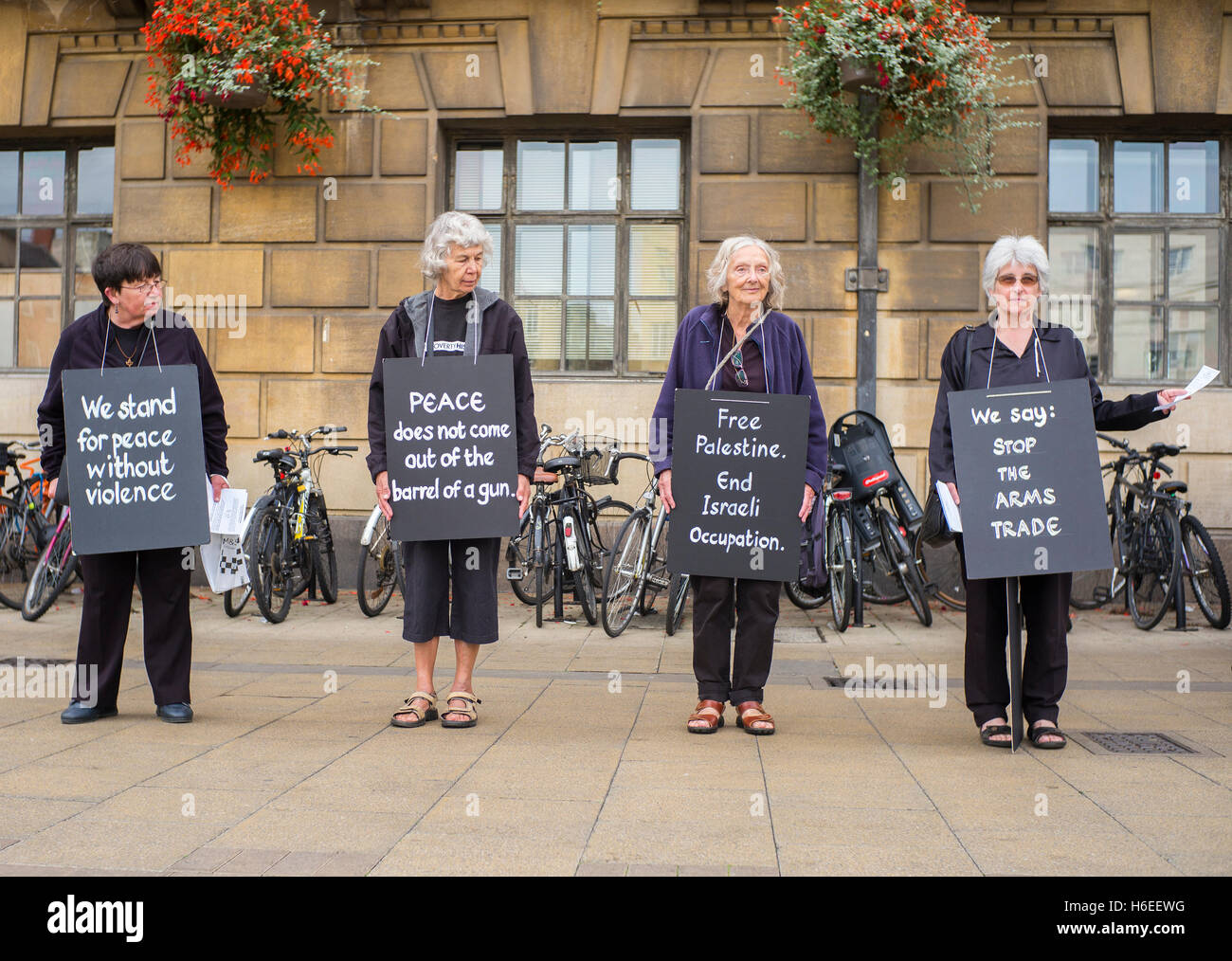 four older ladies making a peace protest in Cambridge Market square "we ...