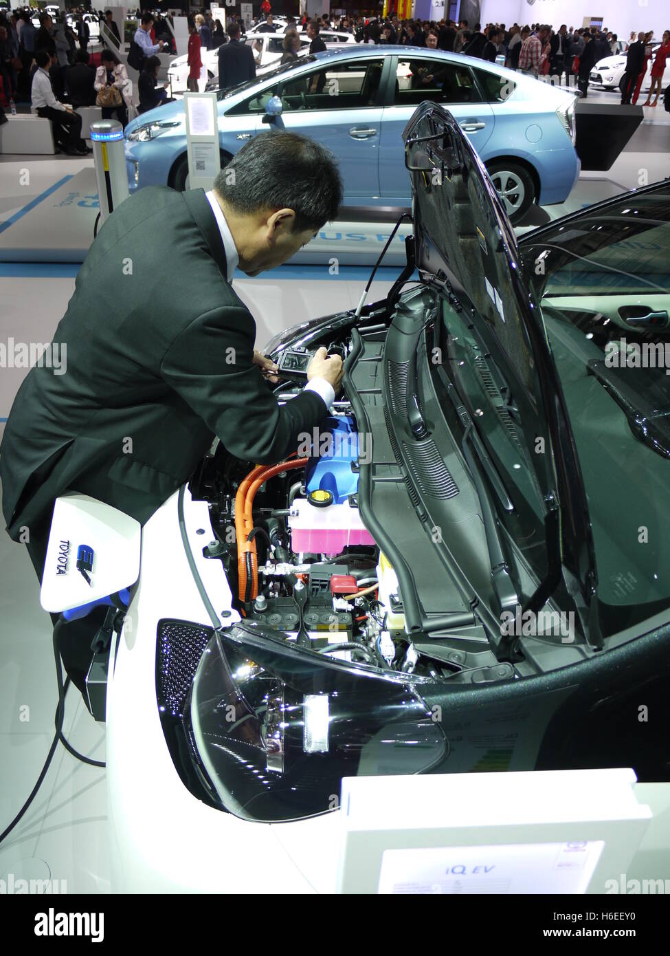 A "journalist" taking pictures of spare parts of a new car during Paris ...