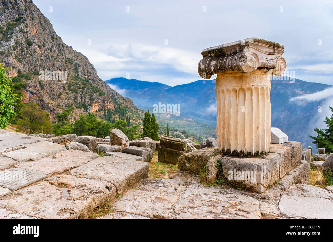 The ruins of ancient Delphi with a view on the foggy valley and ...
