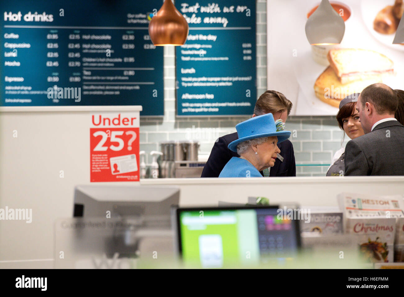 Queen Elizabeth II looks around a Waitrose supermarket during a visit ...
