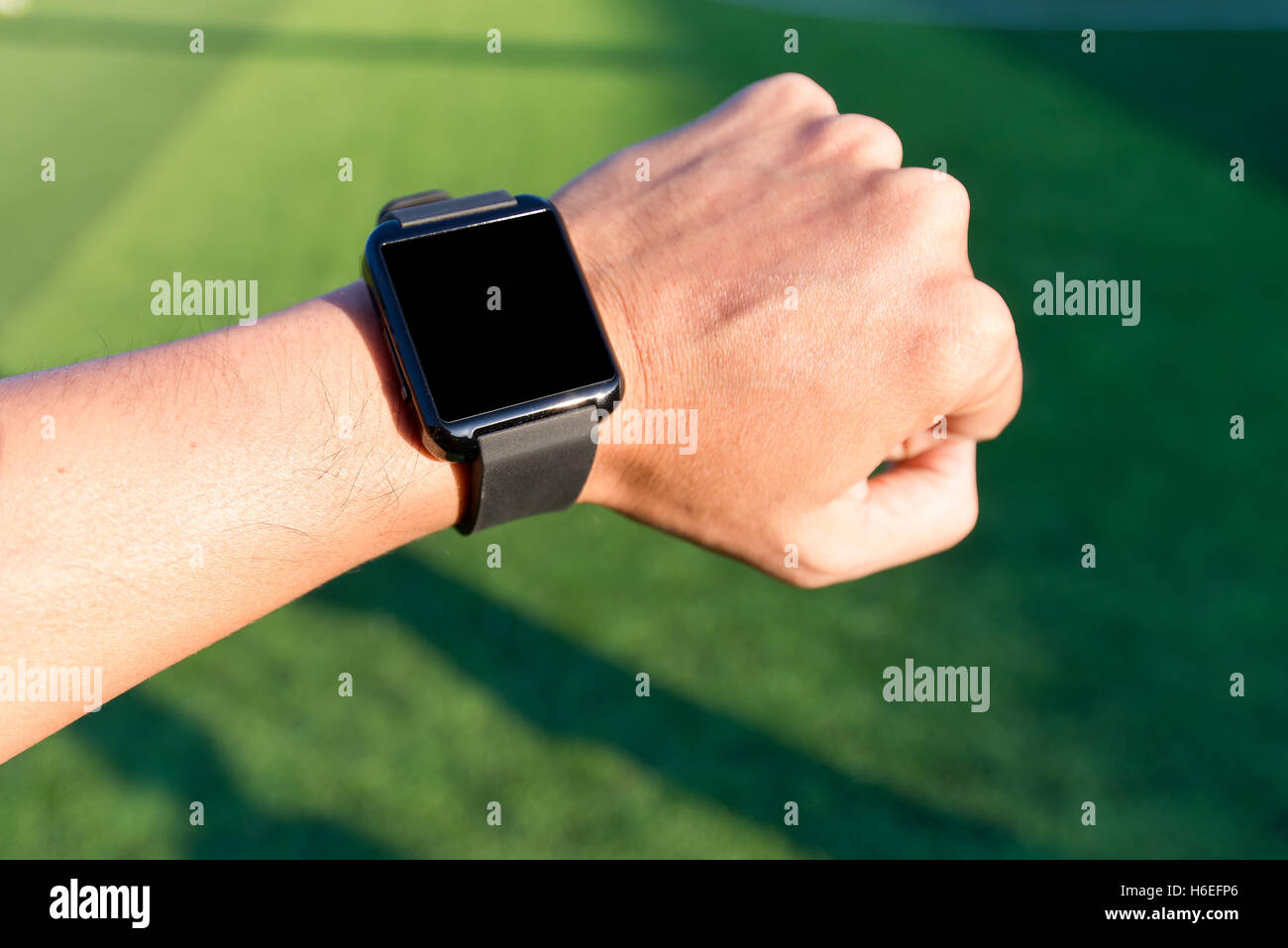 Close-up hands of man using his smart watch exercise Stock Photo - Alamy