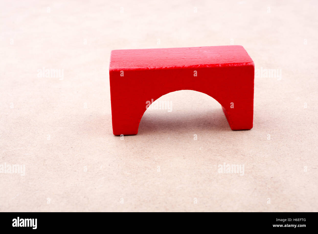 Red building block on a white background Stock Photo - Alamy