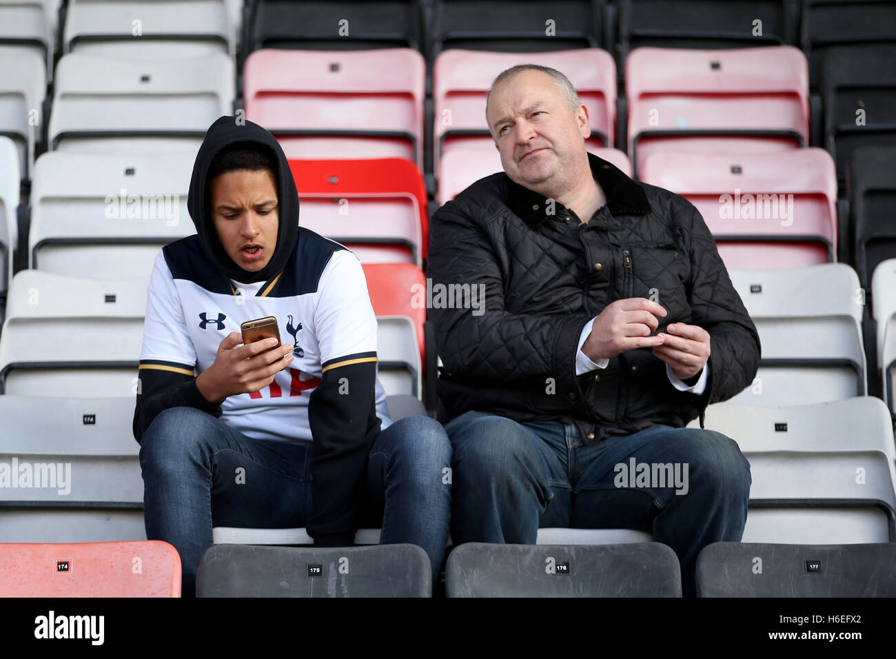 Tottenham Hotspur fans in the stands Stock Photo - Alamy