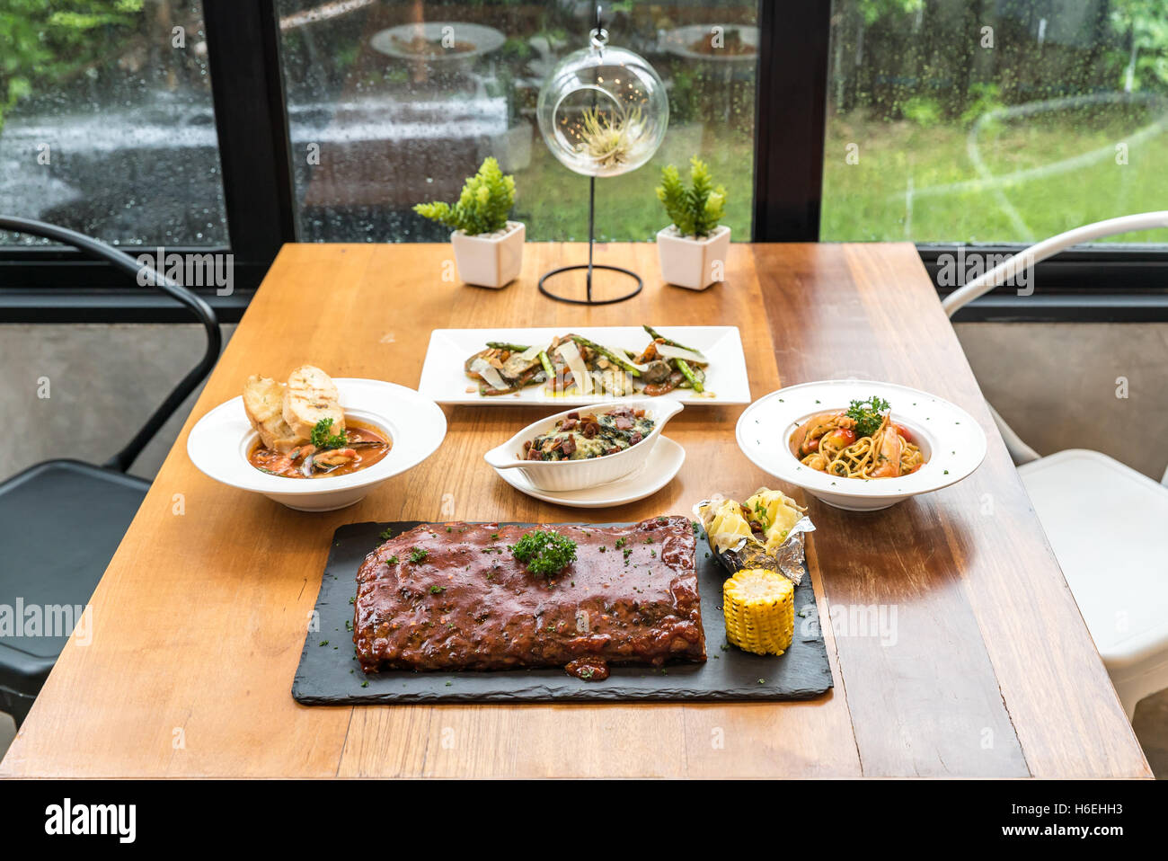 dining table with food ready to eat Stock Photo - Alamy