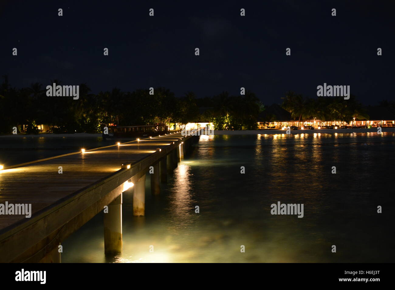 Maldives night water lights pontoon Stock Photo - Alamy