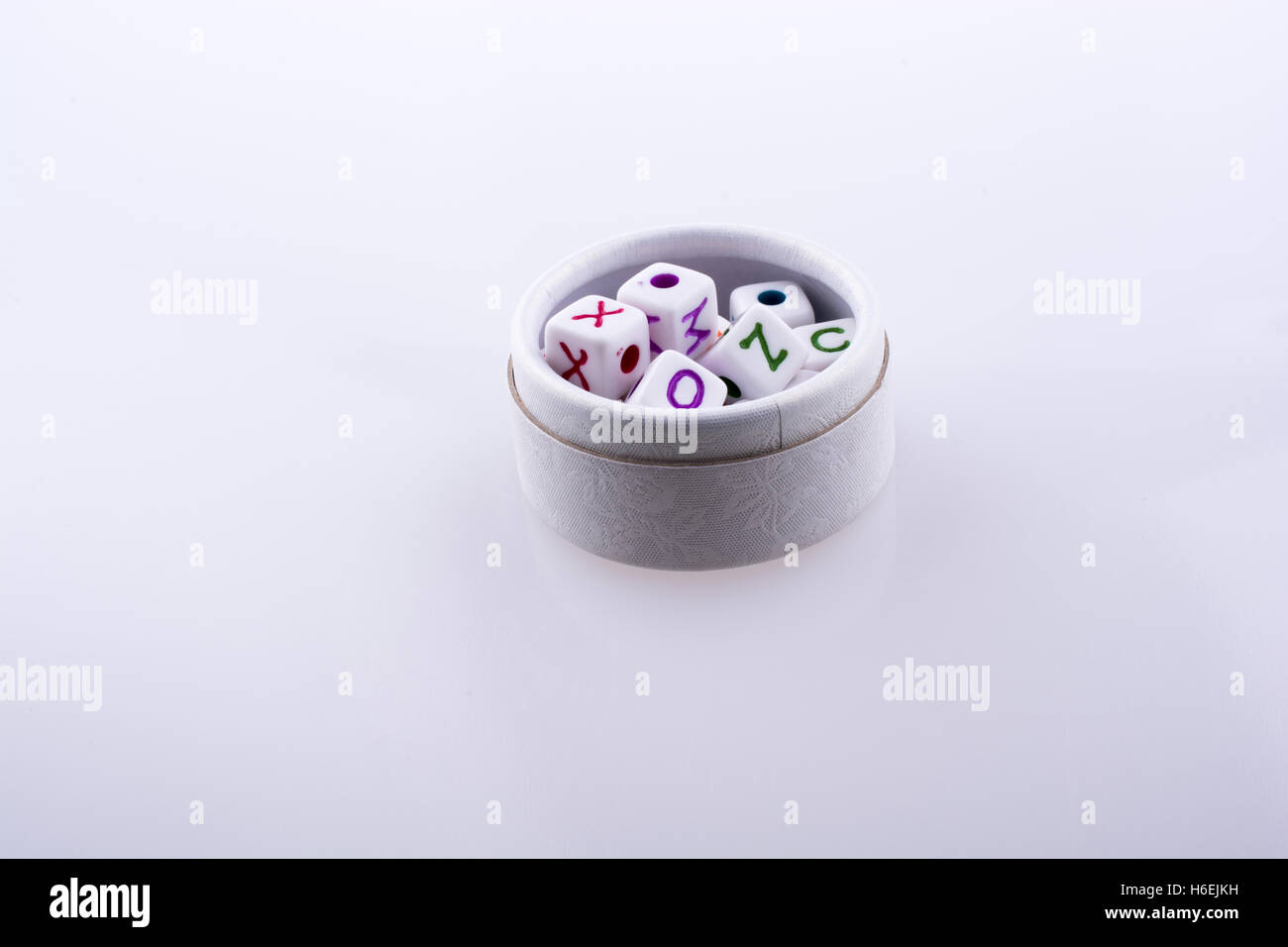 Colorful alphabet letter cubes in a box on a white background Stock ...