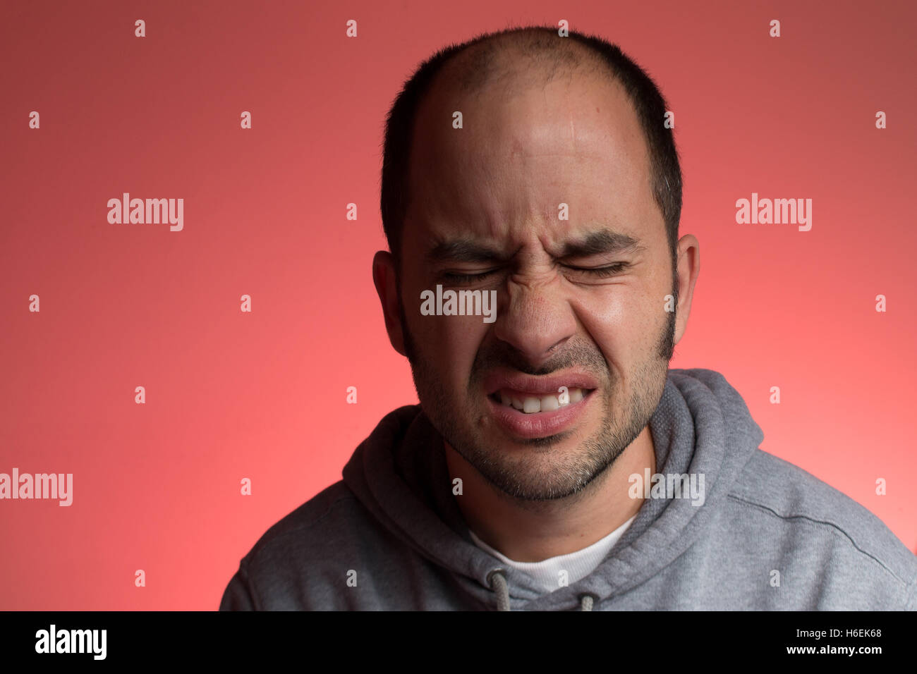 Man with frustrated expression on his face Stock Photo - Alamy