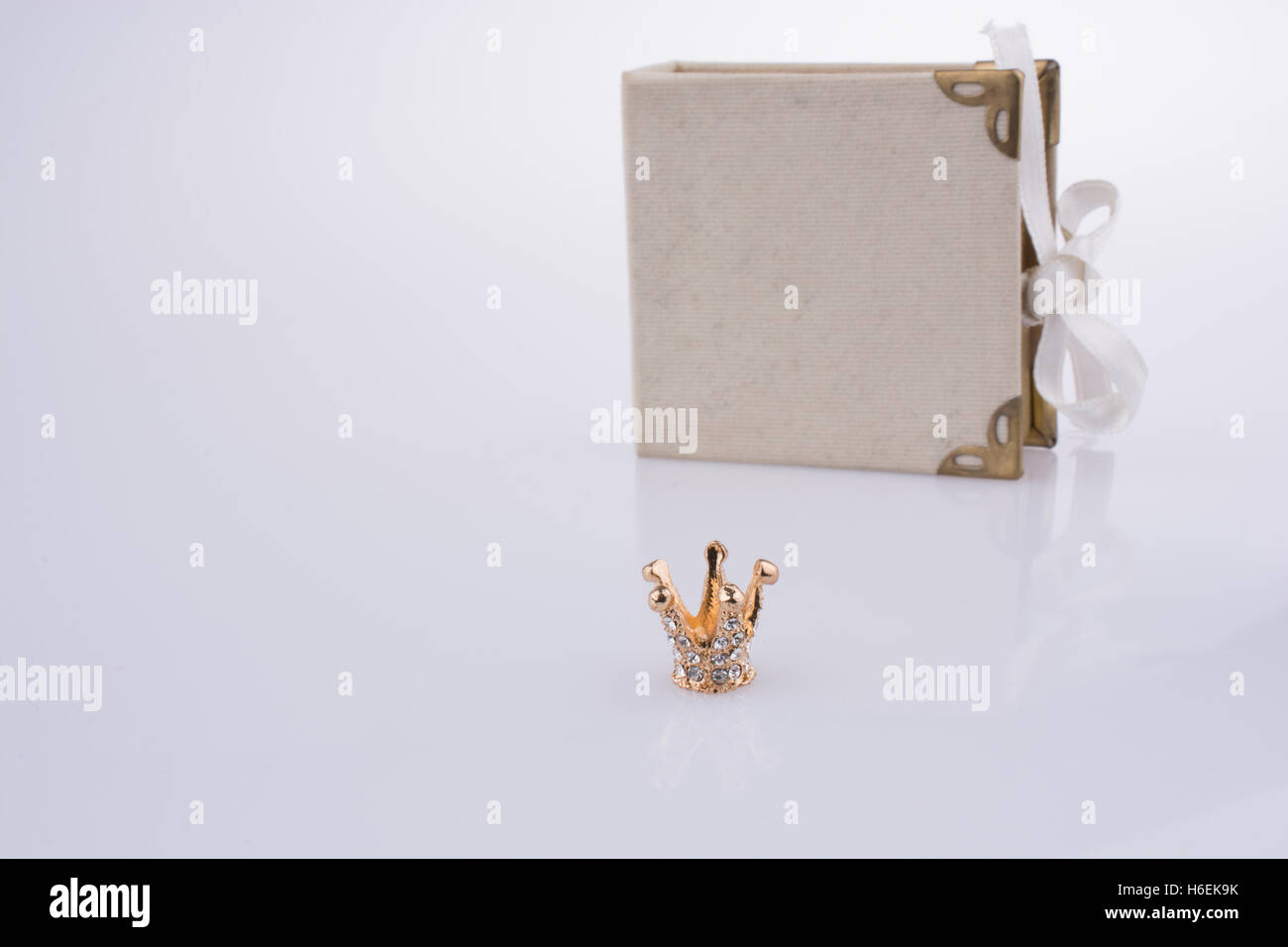 Book model and Golden color crown model with pearls on white background ...