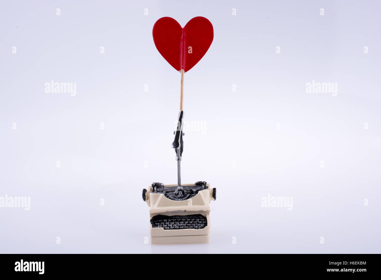 Heart shape icon on a typewriter on white background Stock Photo - Alamy