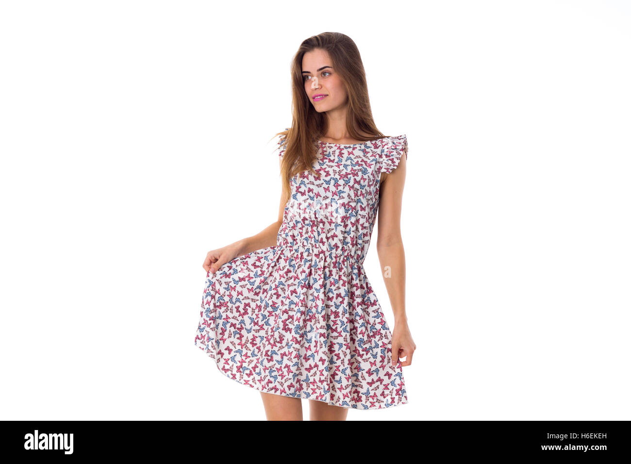 Woman holding her dress Stock Photo - Alamy