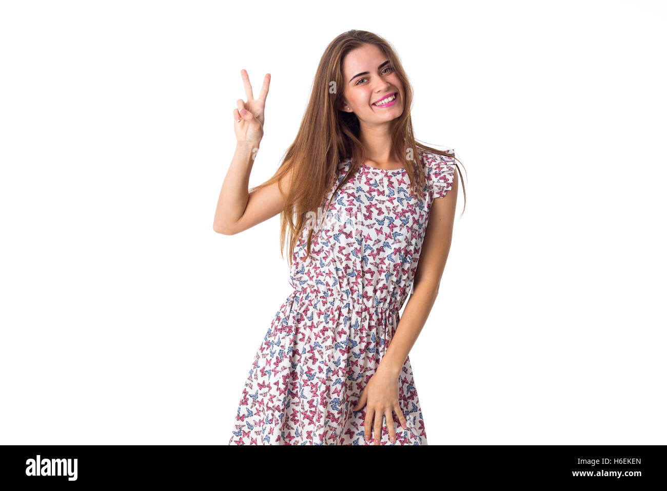 Woman showing peace Stock Photo - Alamy