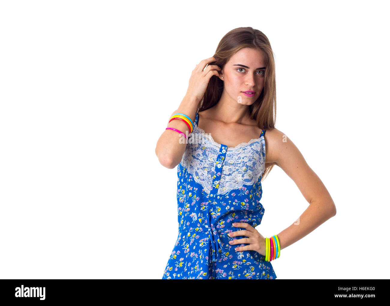 Young woman fixing her hair Stock Photo - Alamy