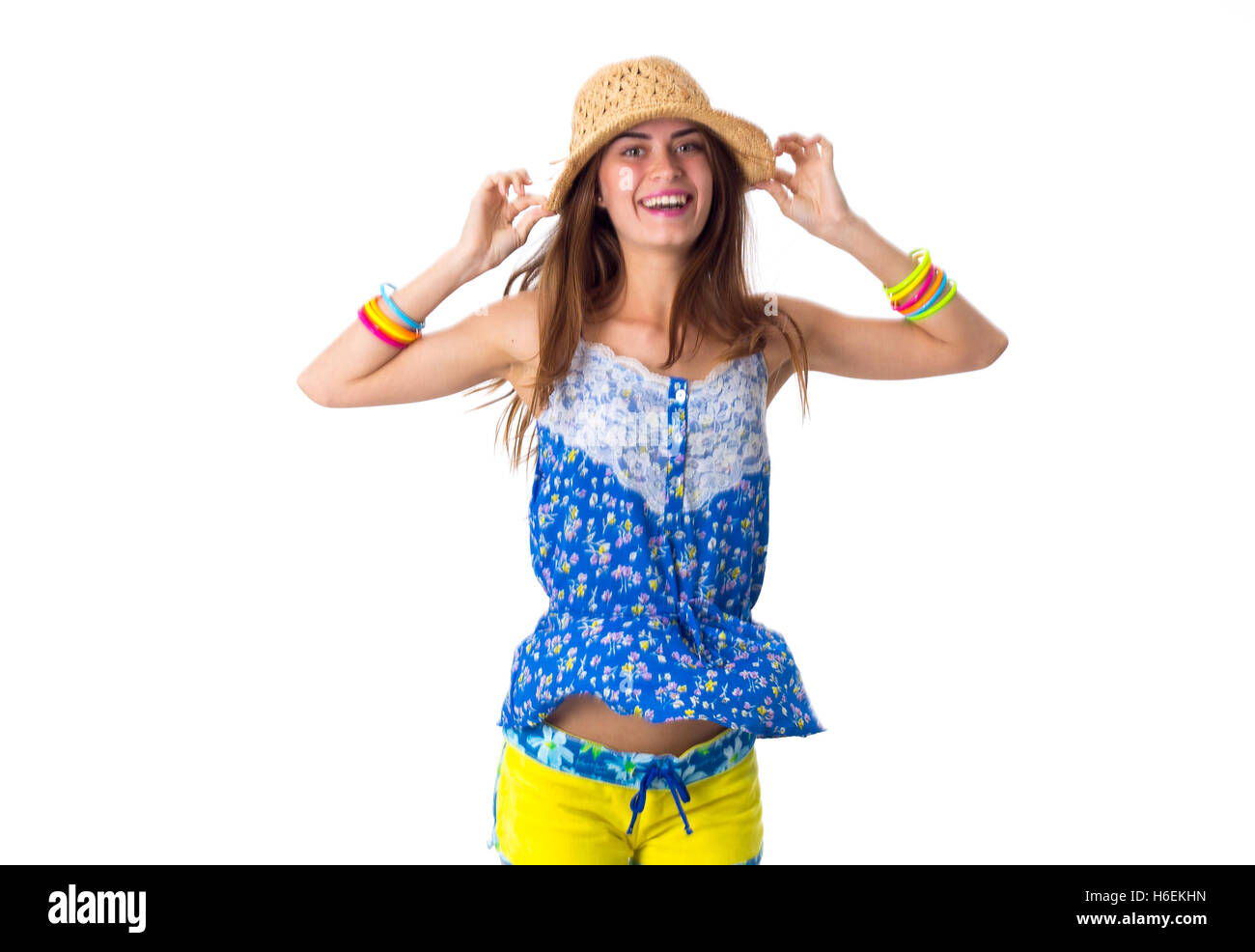 Young woman in hat smiling and jumping Stock Photo - Alamy