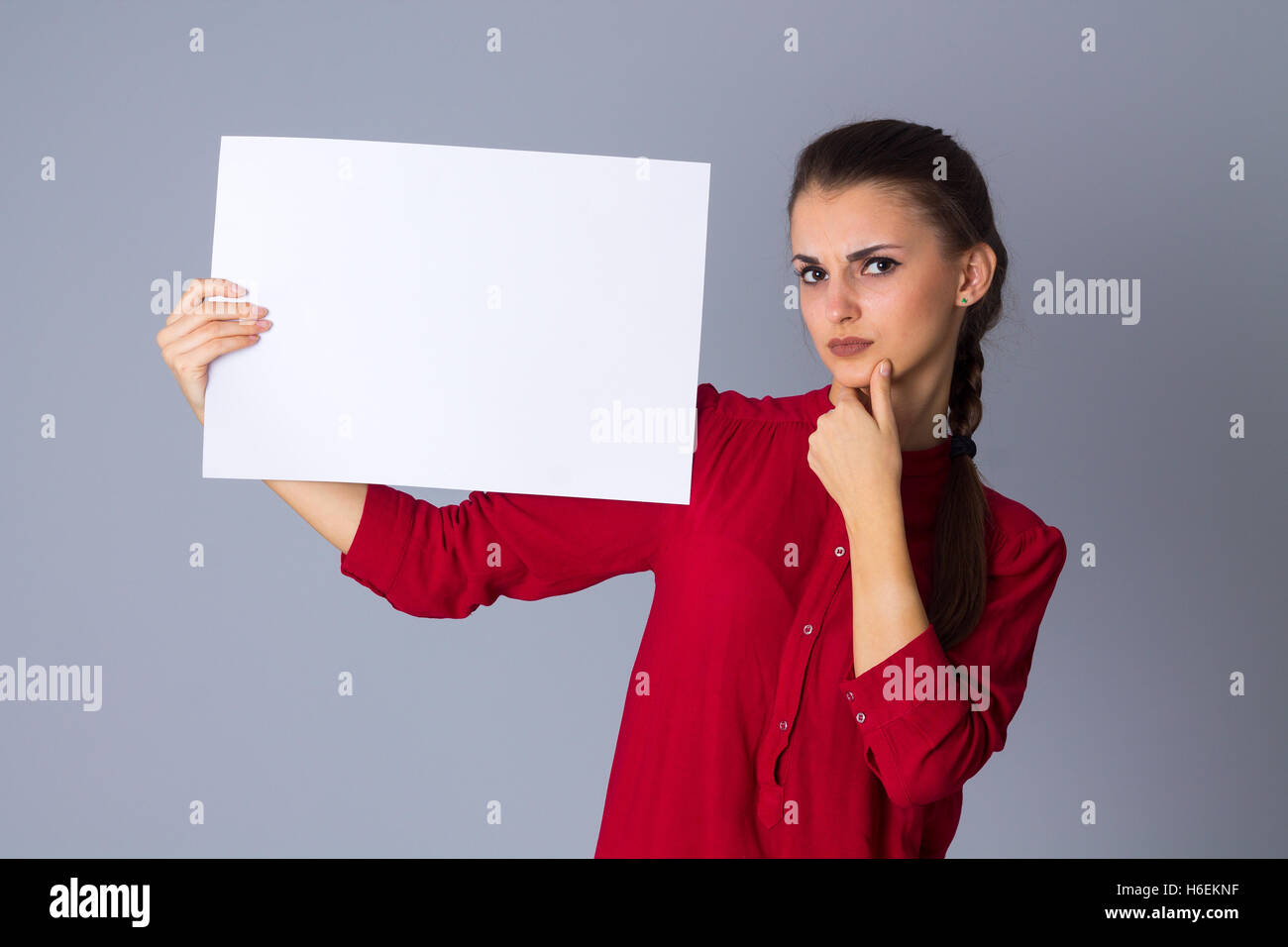 Woman holding white sheet of paper Stock Photo - Alamy