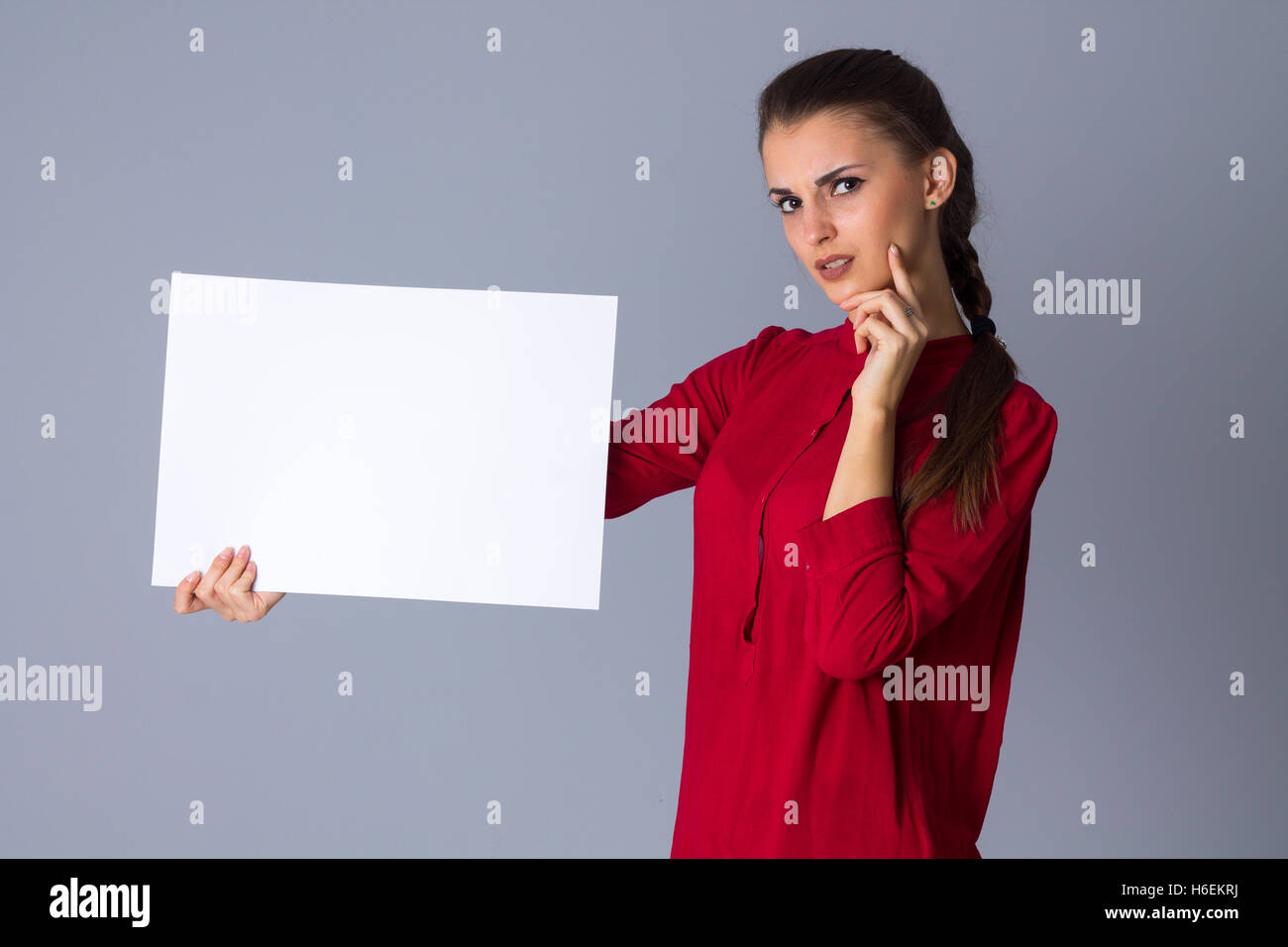 Woman holding white sheet of paper Stock Photo - Alamy