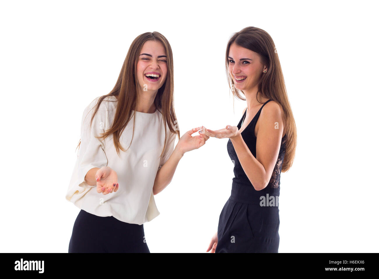 Two young woman talking Stock Photo - Alamy