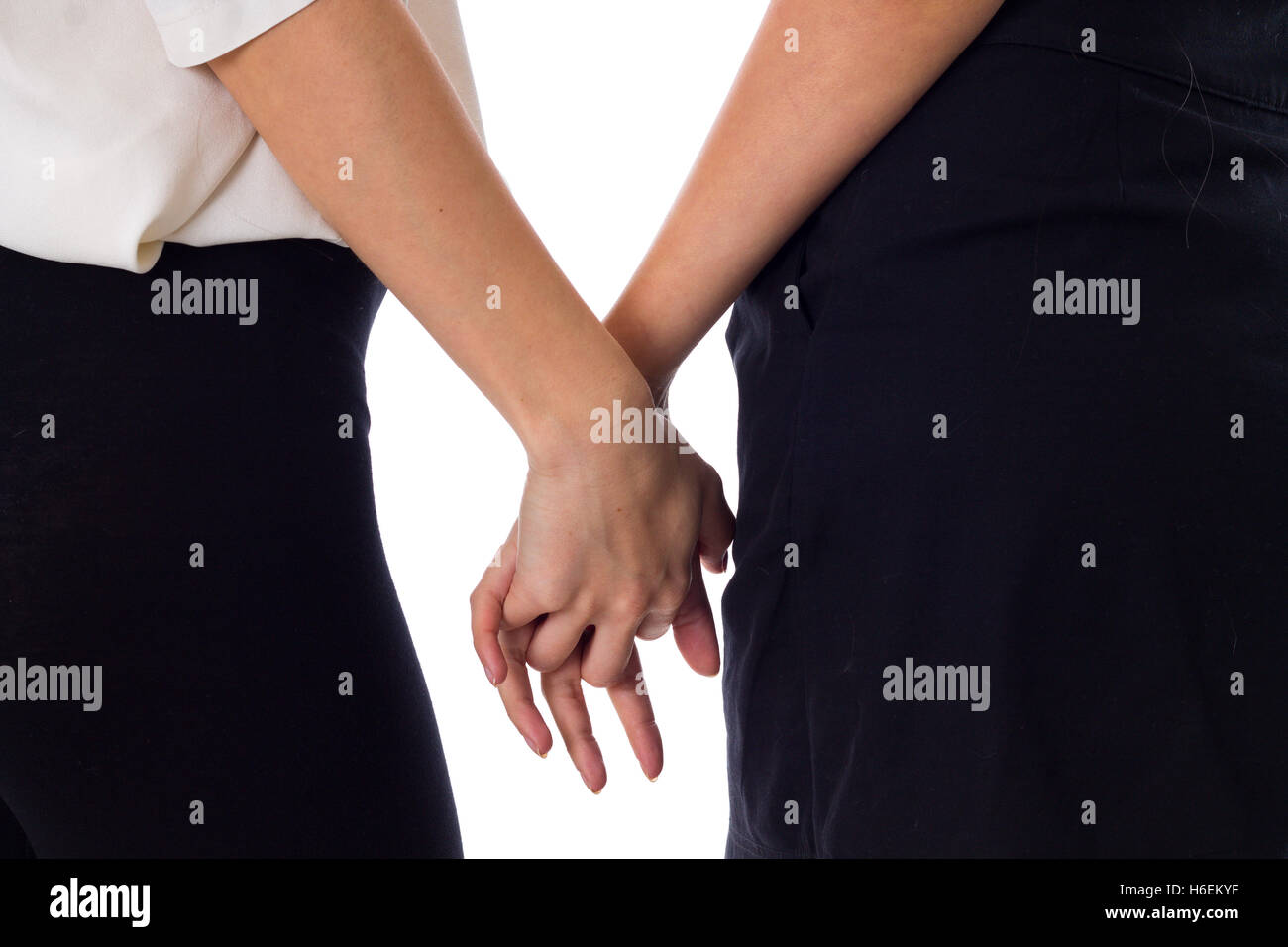 Two young woman holding hands Stock Photo - Alamy Two young woman holding hands Stock Photo - Alamy