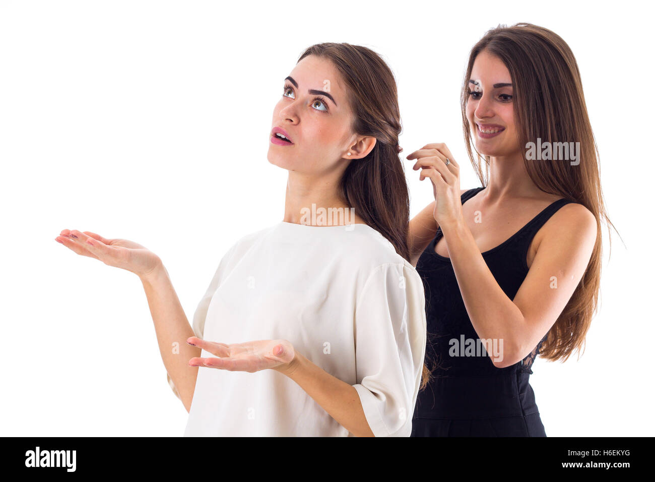 One woman making another one a plait Stock Photo - Alamy