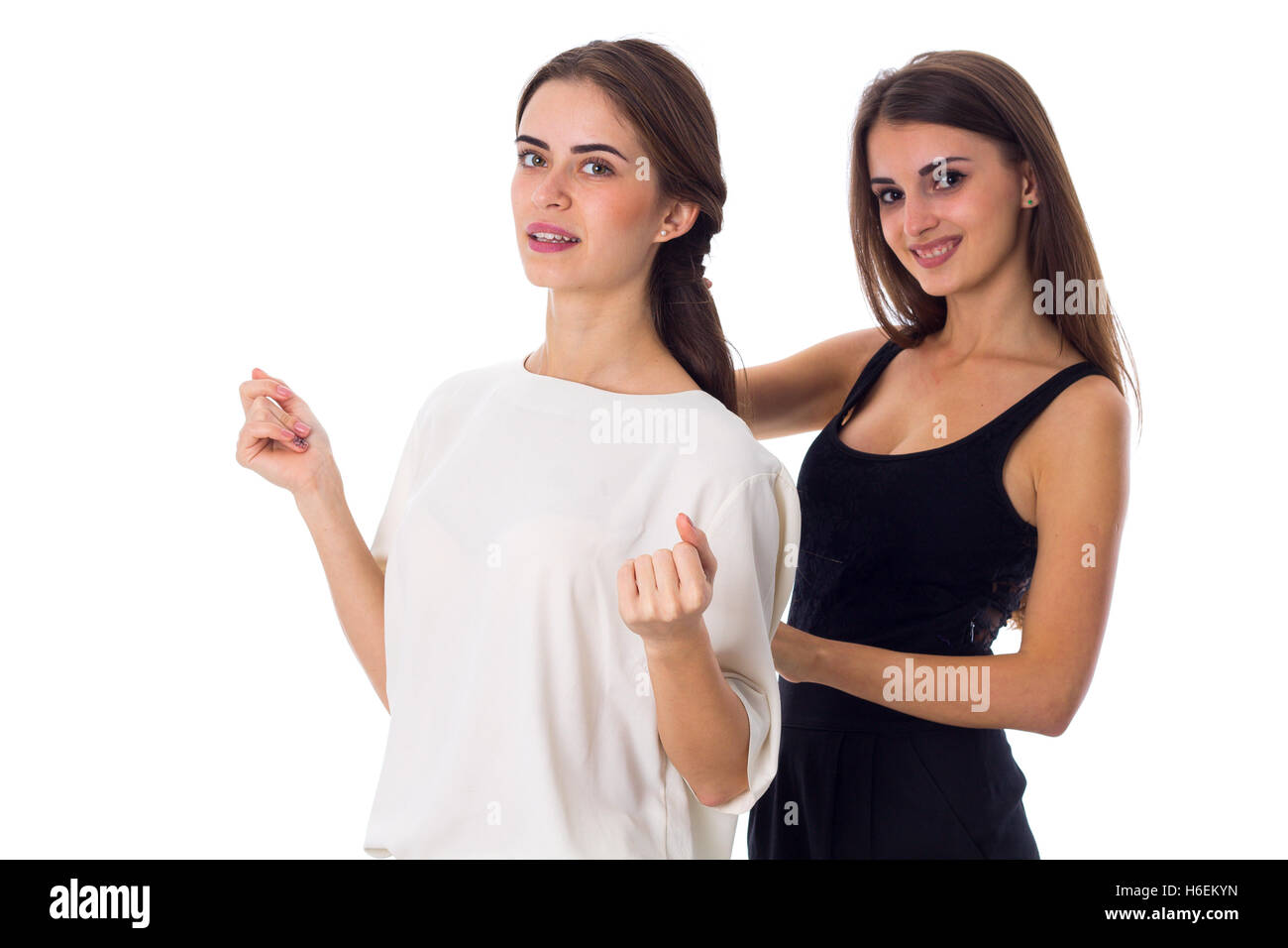 One woman making another one a plait Stock Photo - Alamy