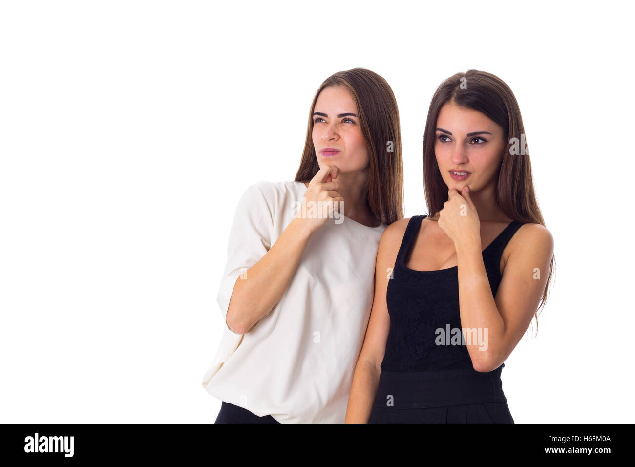 Two young woman looking on something Stock Photo - Alamy
