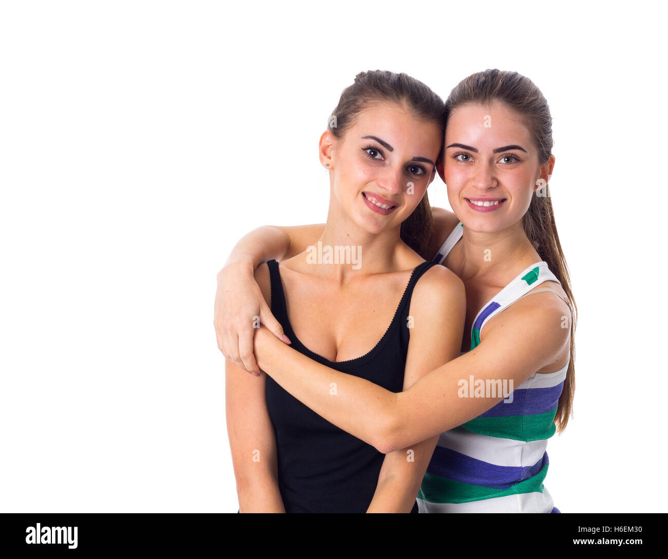 Two young women hugging Stock Photo - Alamy