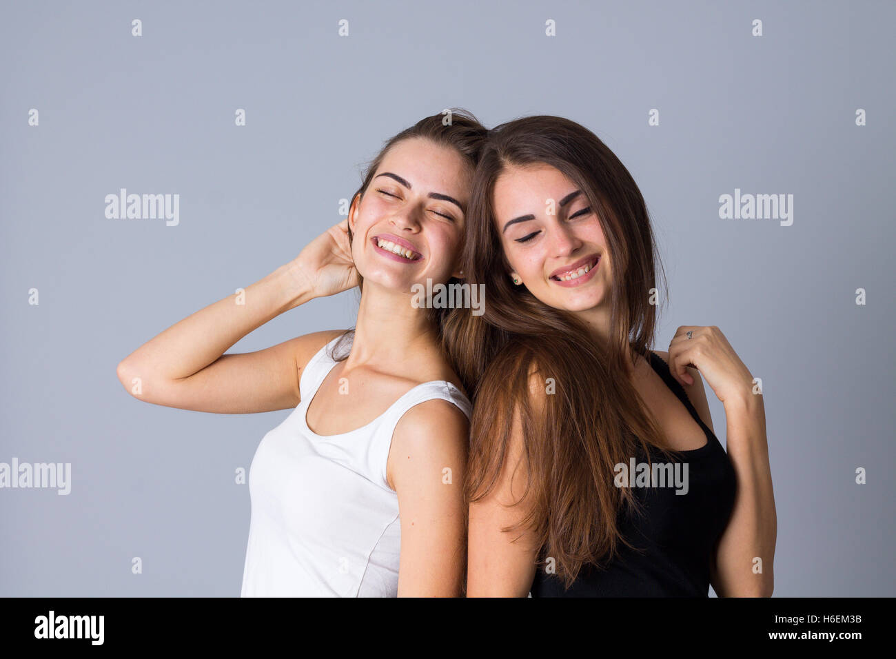 Two young women smiling Stock Photo - Alamy