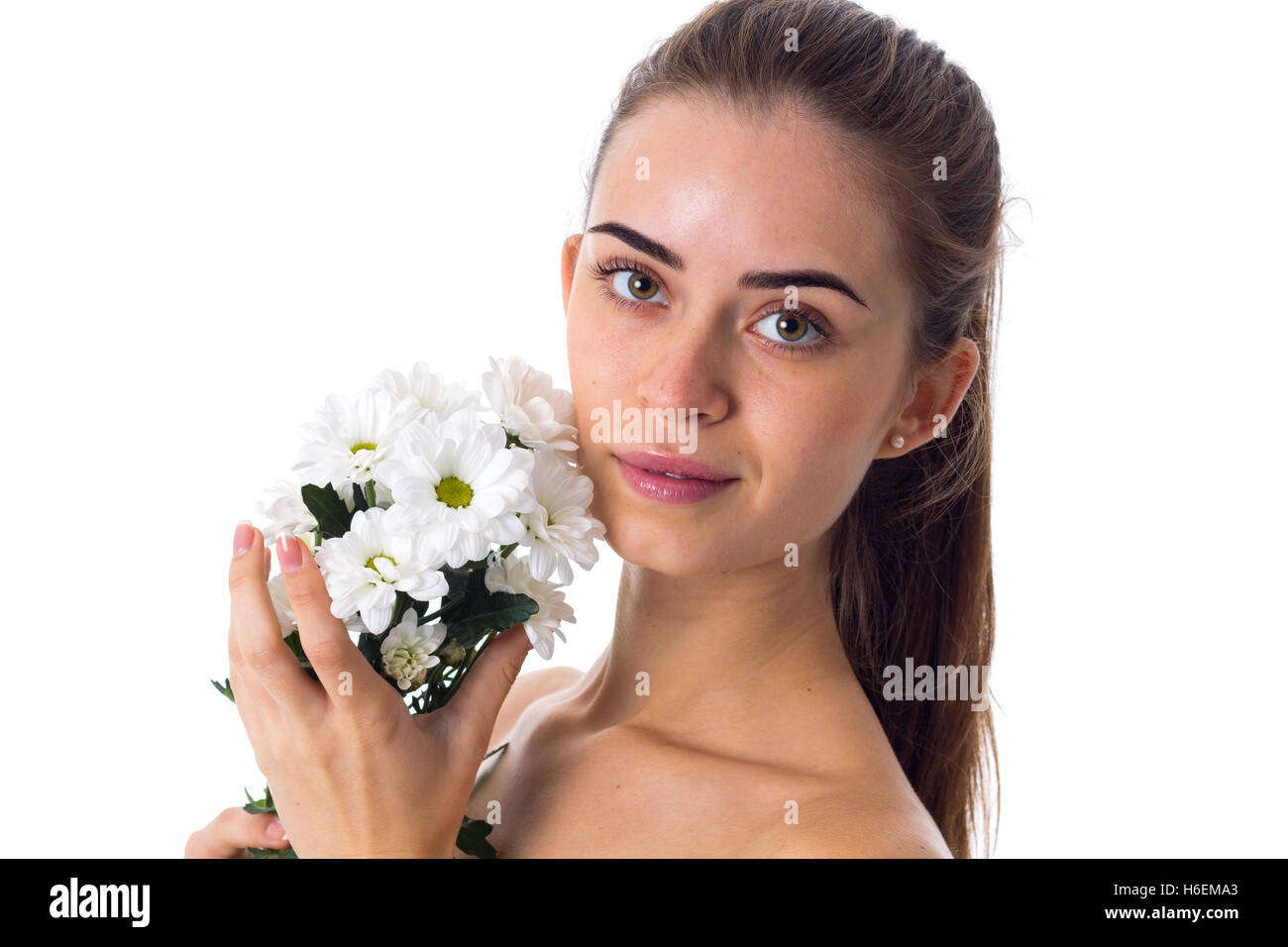 Young woman holding white flowers Stock Photo - Alamy
