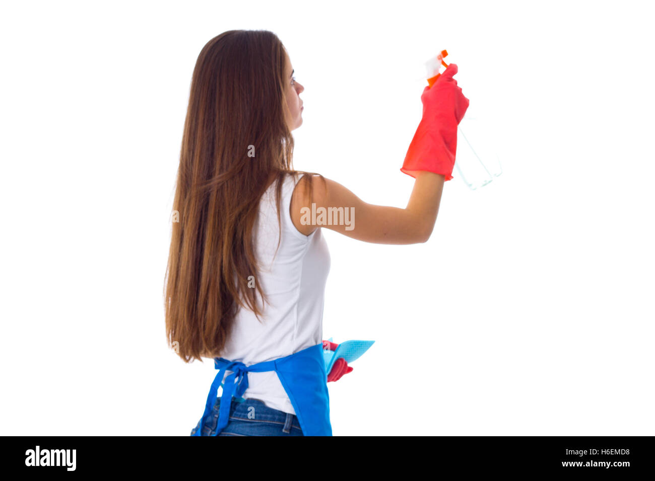 Woman using duster and detergent Stock Photo - Alamy
