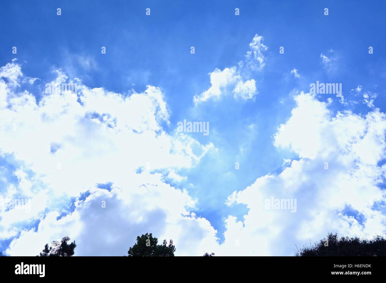 Bright white clouds on a bright summer day Stock Photo - Alamy