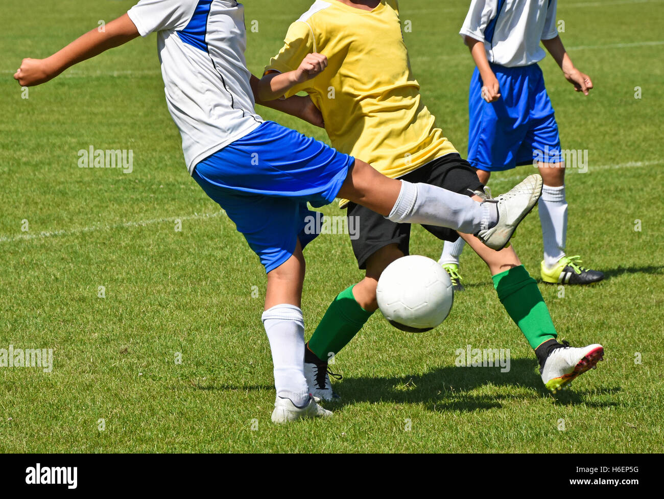 Children are playing soccer outdoors Stock Photo - Alamy