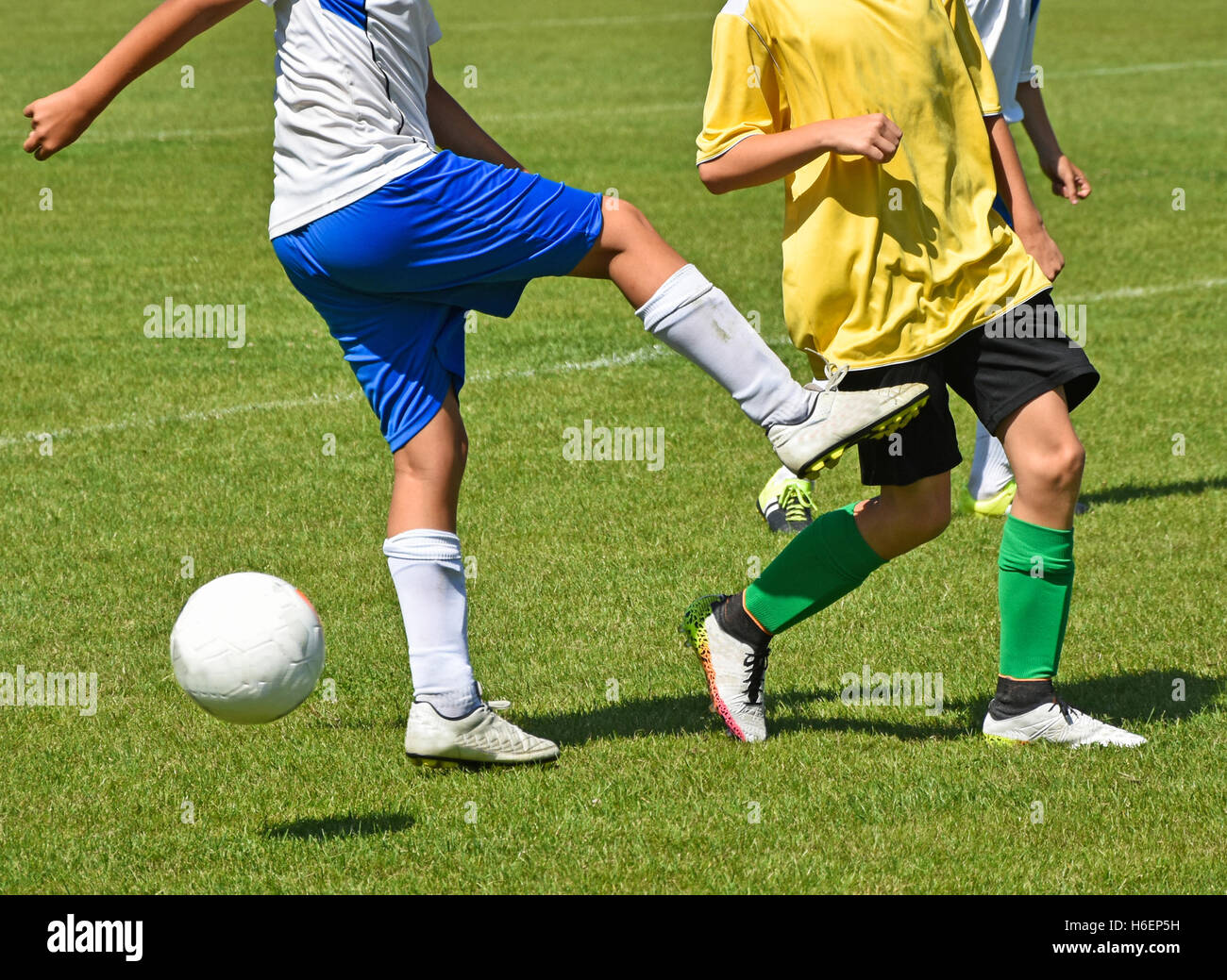 Kids are playing soccer in summer Stock Photo - Alamy