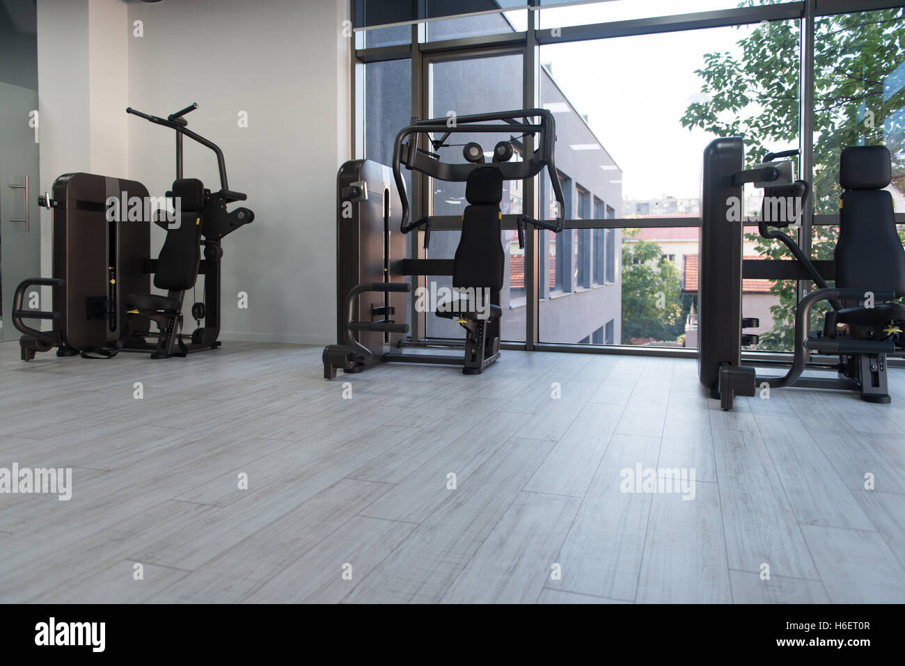 Modern Gym Room Fitness Center With Equipment And Machines Stock Photo ...