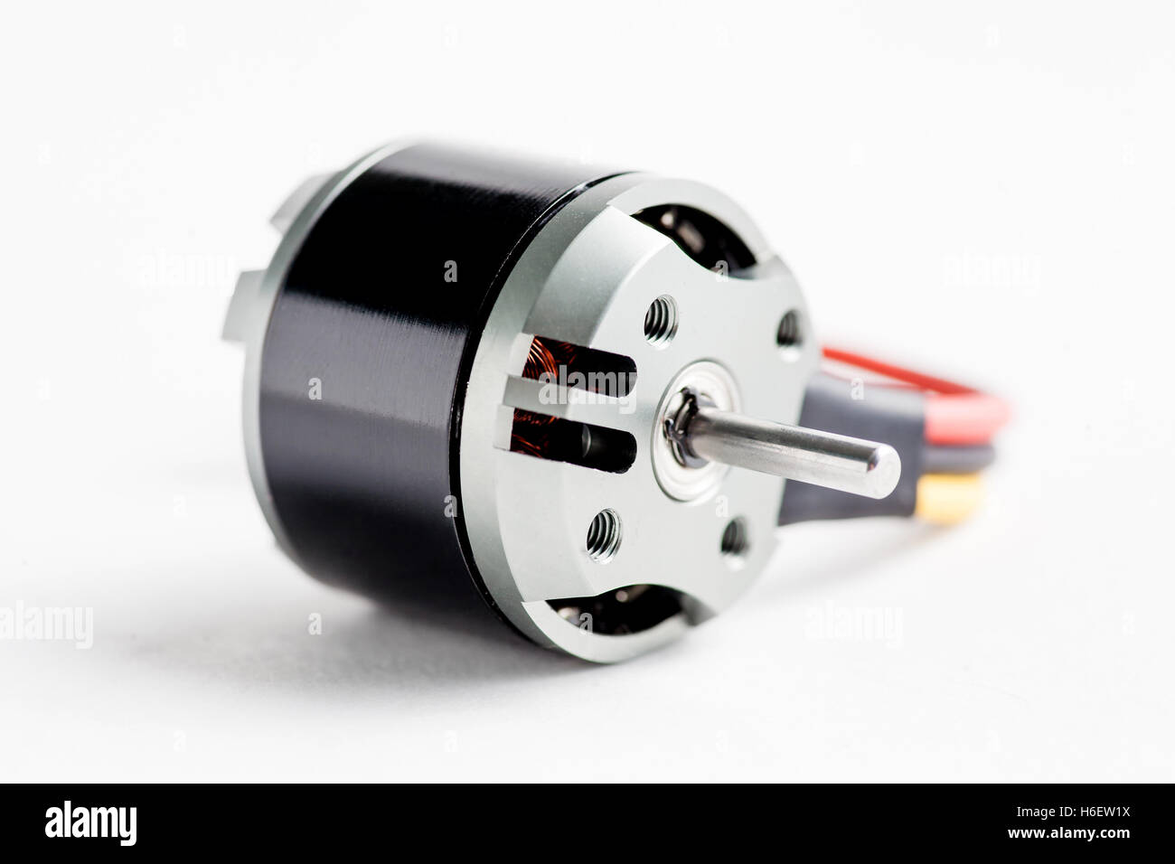 Small electric motor on white Stock Photo - Alamy