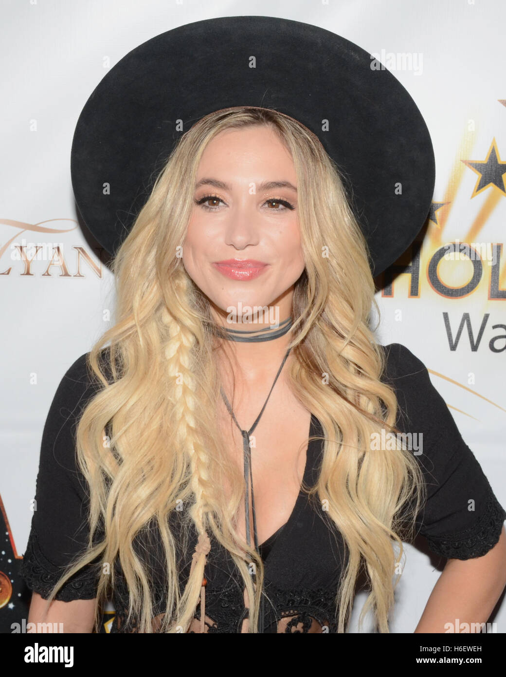 Hat looking at camera smiling fame hi-res stock photography and images ...